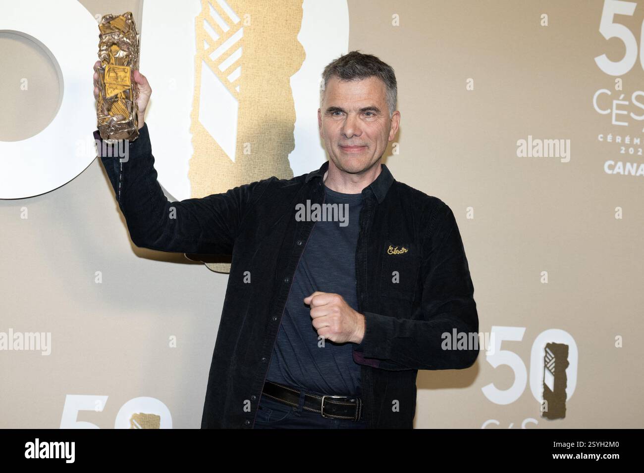 Gilles Perret poses in the winners room with the Best Documentary Cesar ...