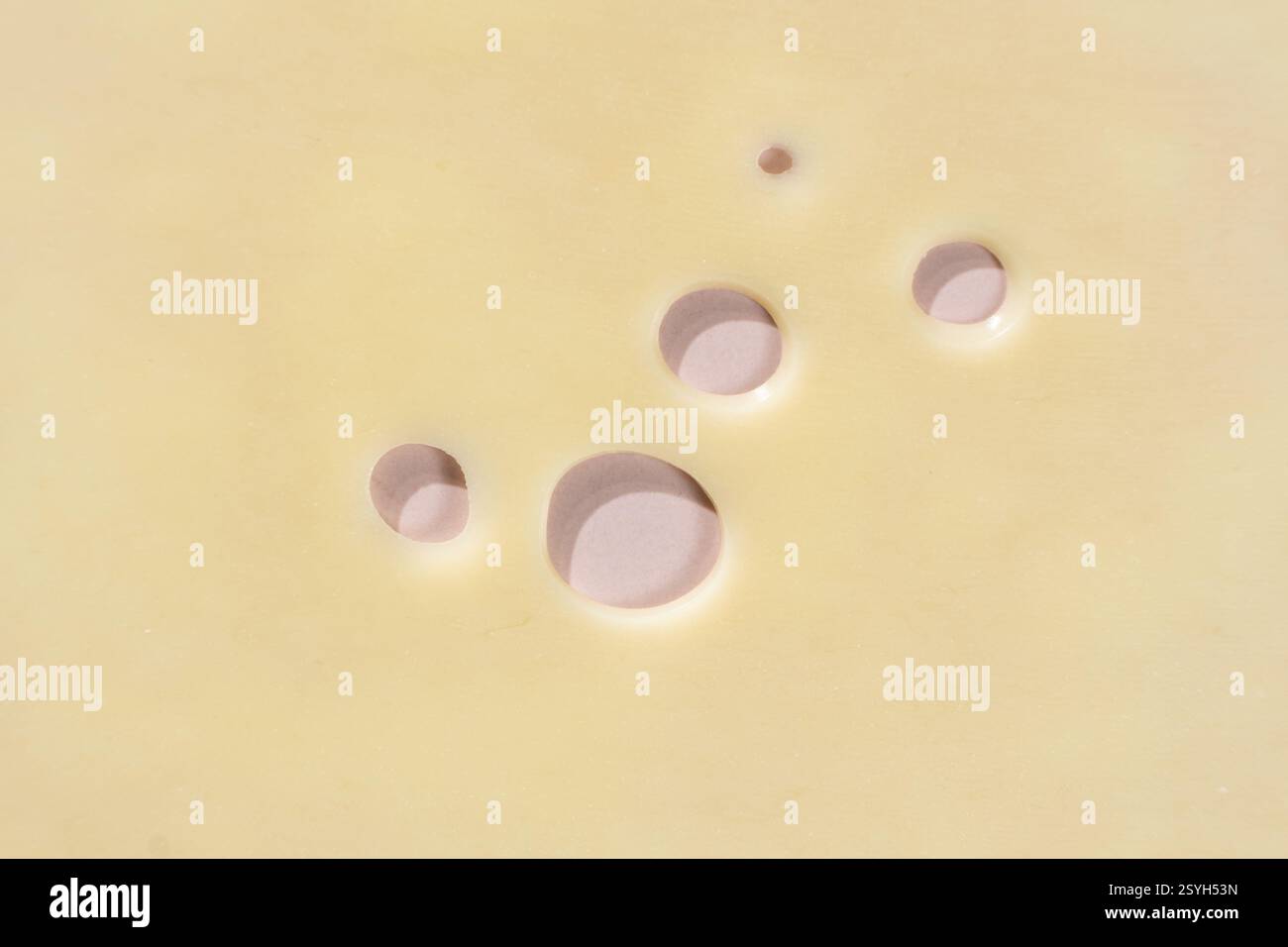 Smooth Yellow Cheese with Characteristic Holes Stock Photo - Alamy