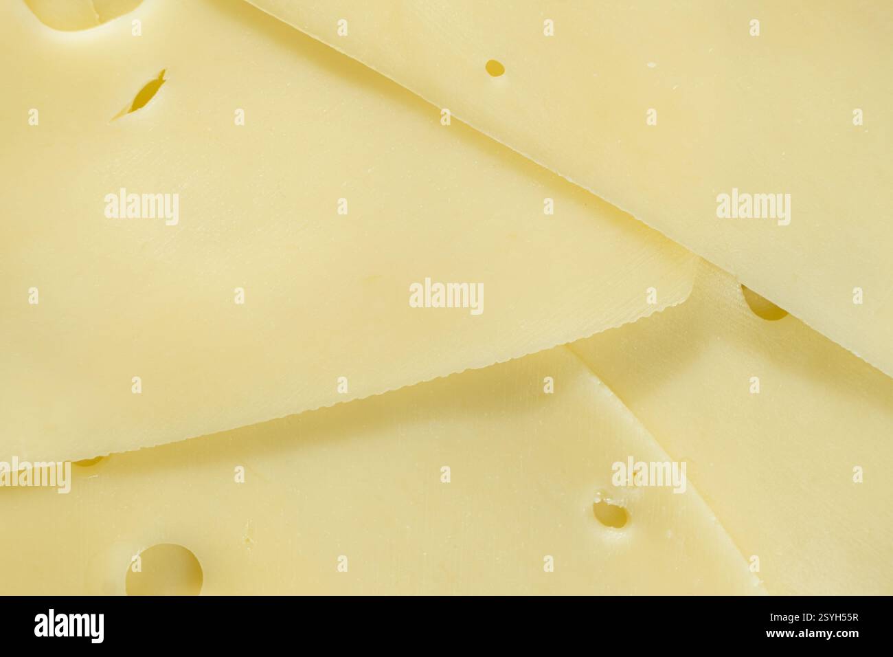 Smooth Yellow Cheese with Characteristic Holes Stock Photo - Alamy