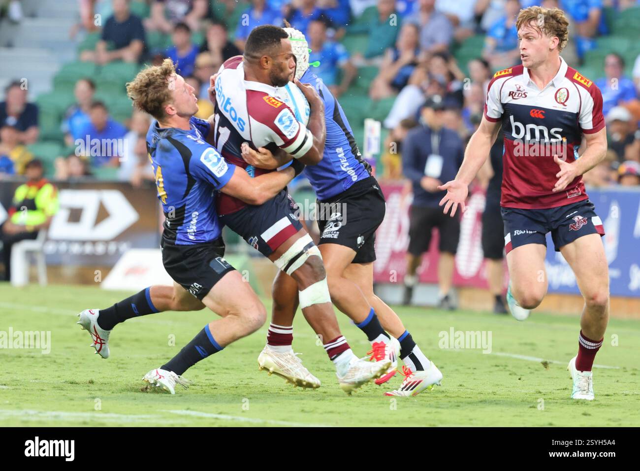 Perth, Australia. 01st Mar, 2025. Filipo Daugunu of the Reds is tackled ...
