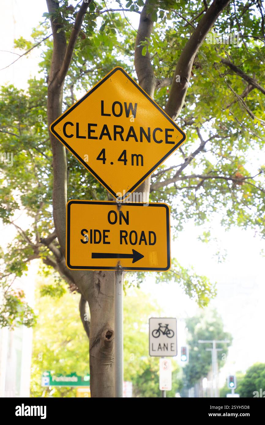 low clearance warning sign on the side road Stock Photo - Alamy