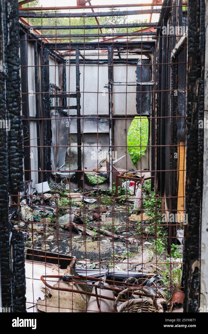Vouliagmeni, Greece - February 28, 2025. Burned, destroyed interior of ...