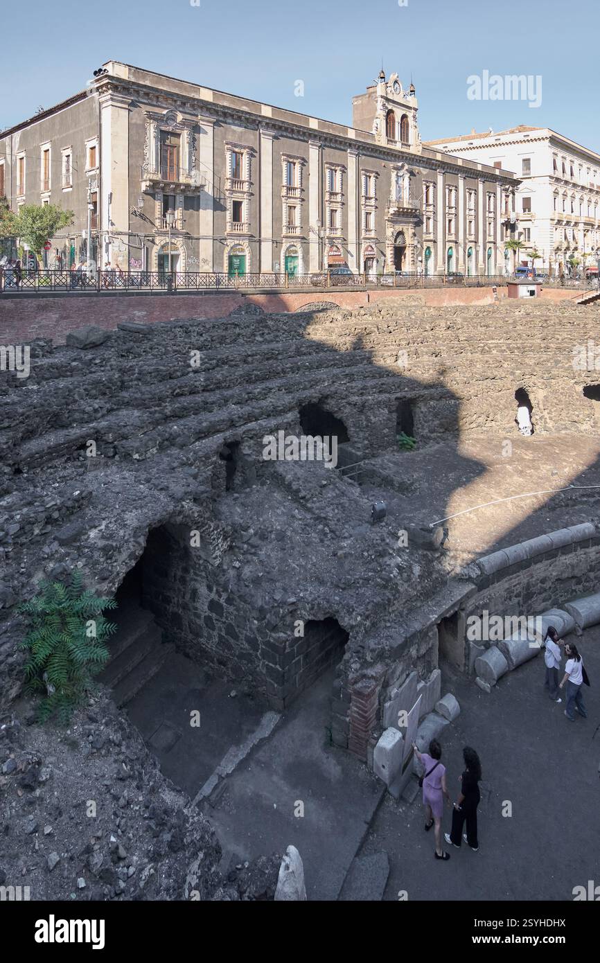 Catania. Italy - March 3, 2025: Ancient Roman Amphitheater ruins with ...