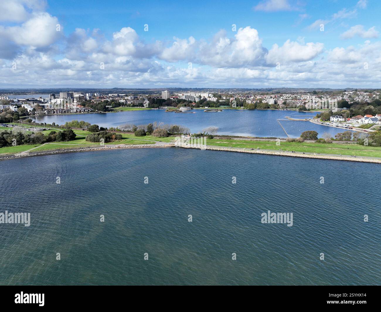 an aerial picture of Poole Park lake and part of Poole Harbour on a ...