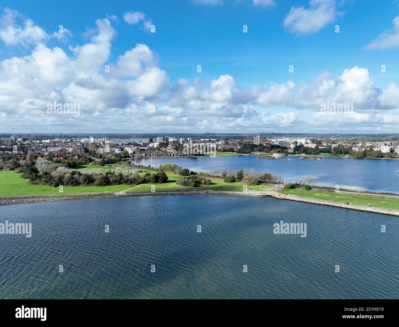 an aerial picture of Poole Park lake and part of Poole Harbour on a ...