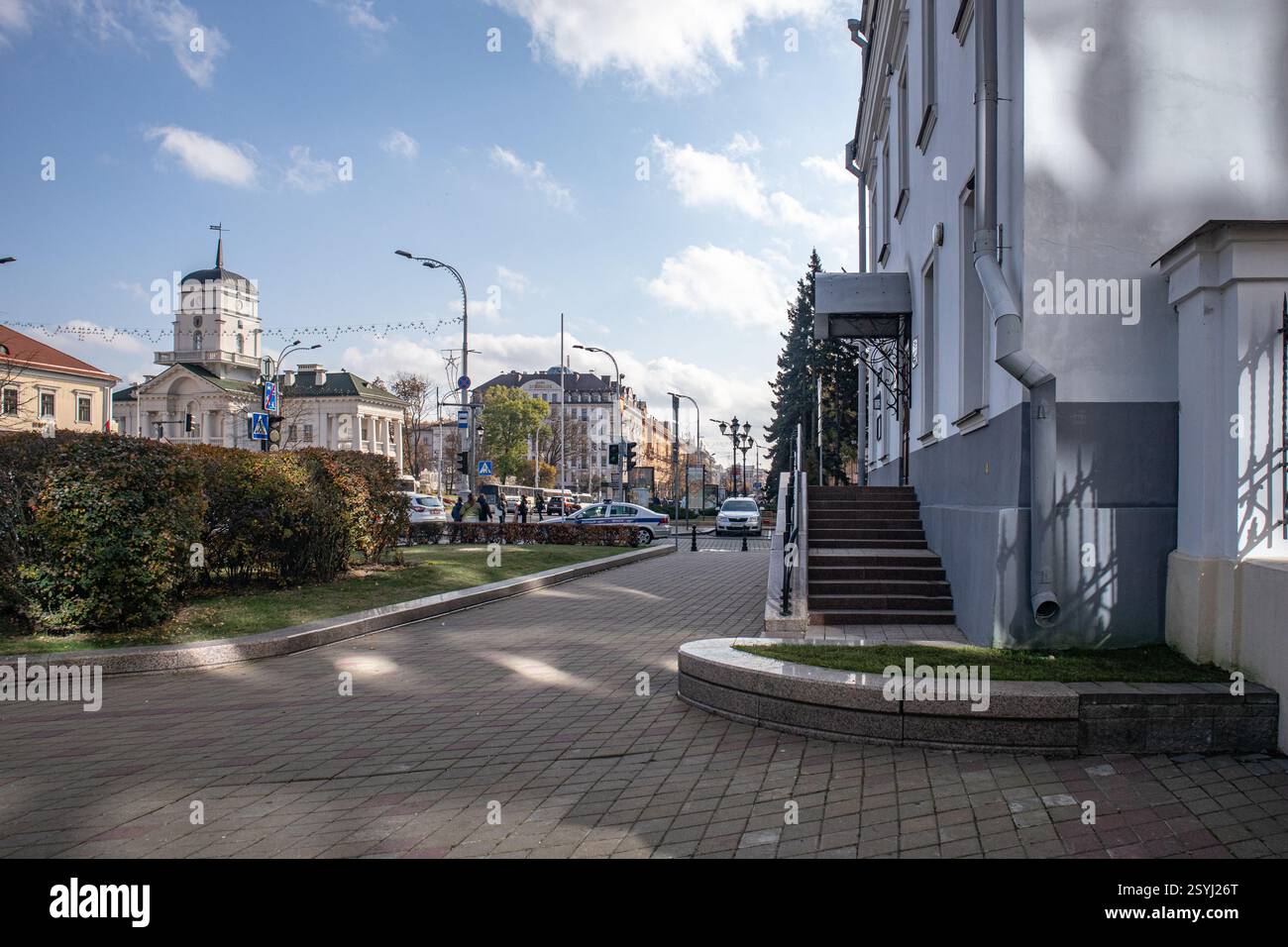 Walking through a vibrant town, sunlight casts gentle shadows on the ...