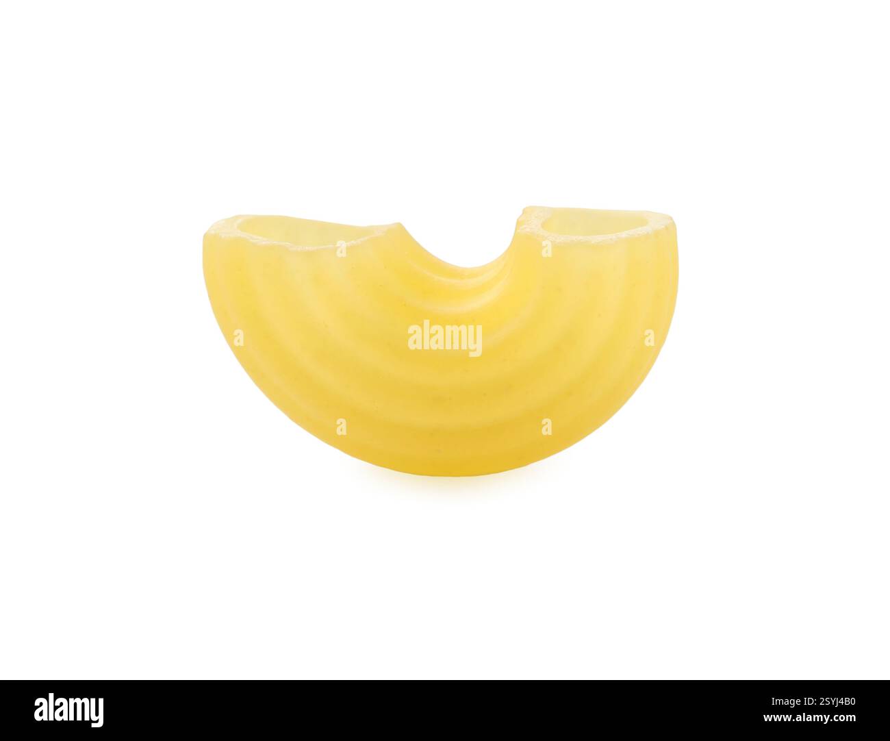 One piece of raw horns pasta isolated on white Stock Photo - Alamy