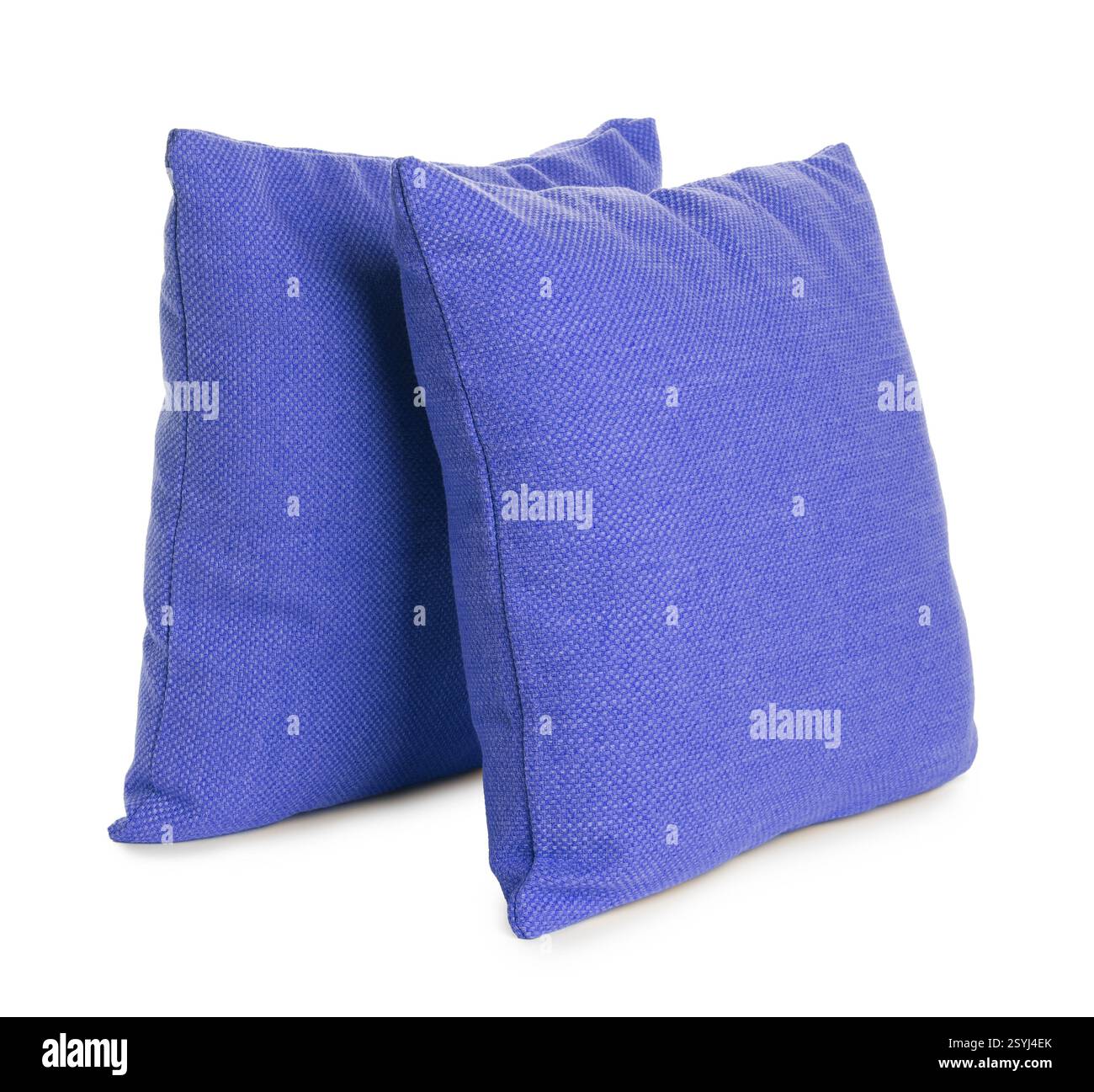 Bright blue cushions on bed Cut Out Stock Images & Pictures - Alamy