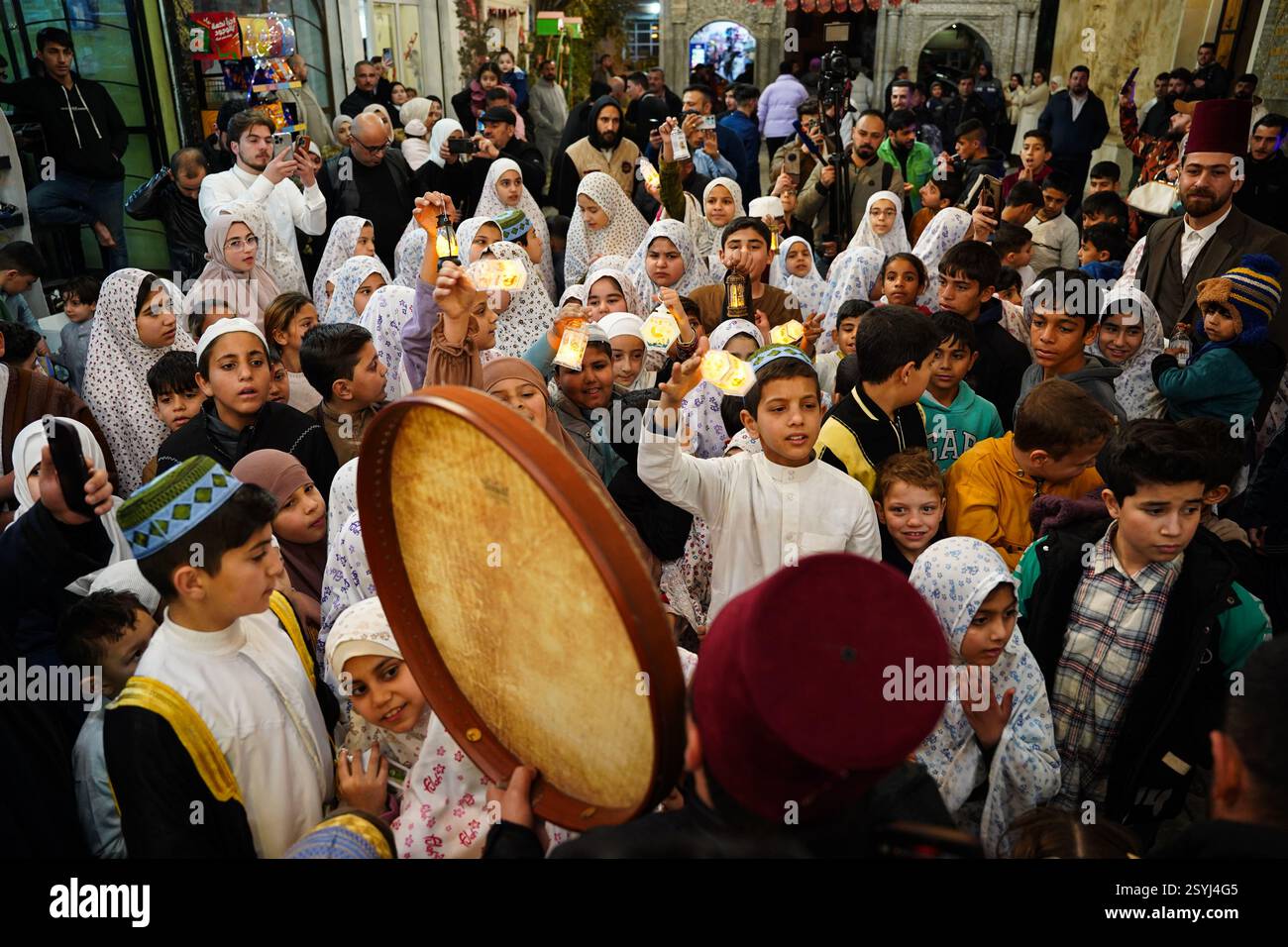 Mosul, Iraq. 28th Feb, 2025. A man in traditional dress plays the ...