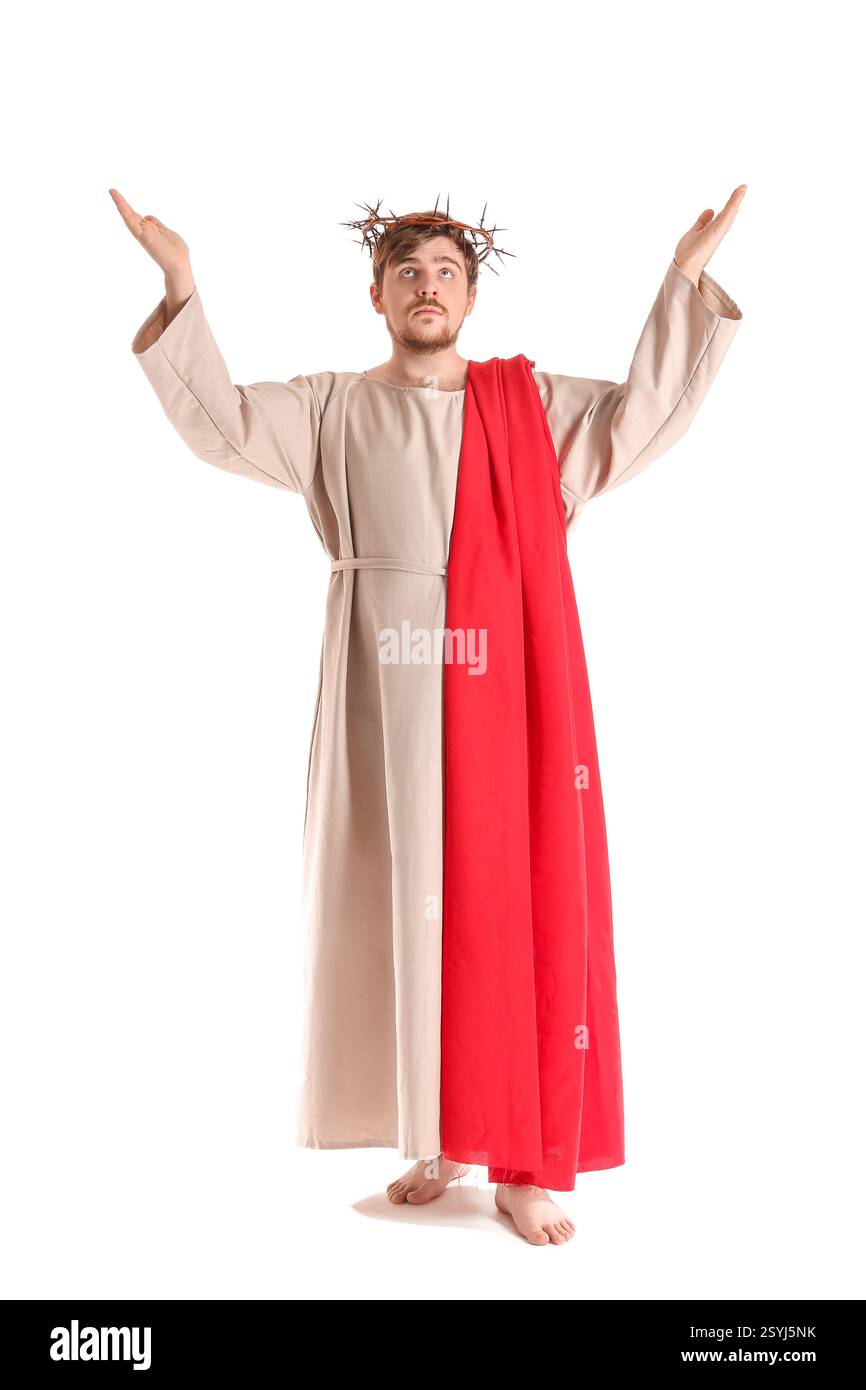 Man in Jesus robe and crown of thorns with outstretched hands on white ...