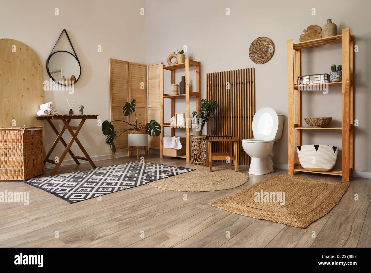 Interior of restroom with toilet bowl, tables and shelf units Stock ...