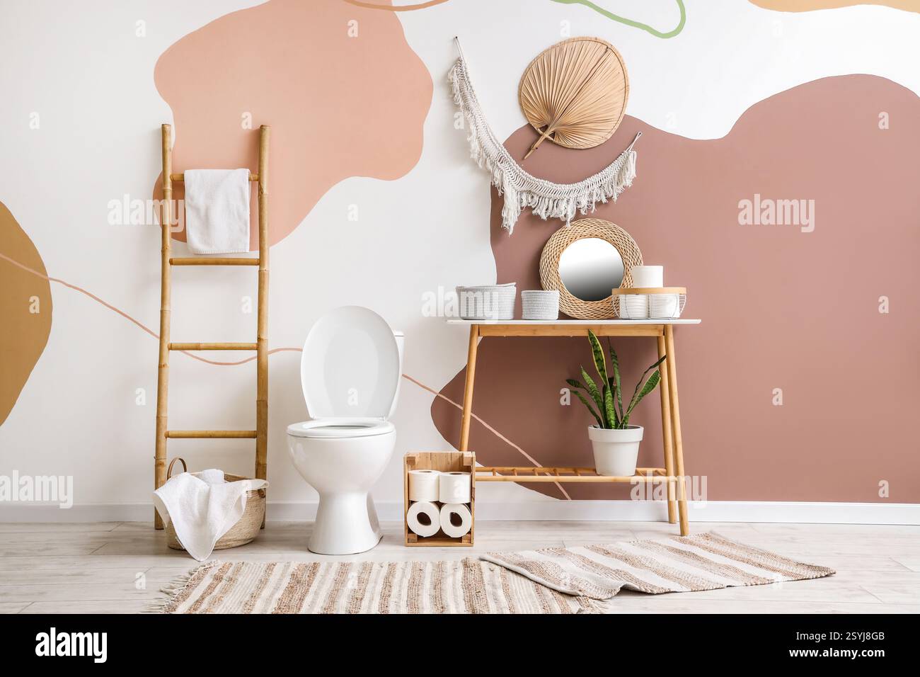 Interior of restroom with toilet bowl, ladder and table Stock Photo - Alamy
