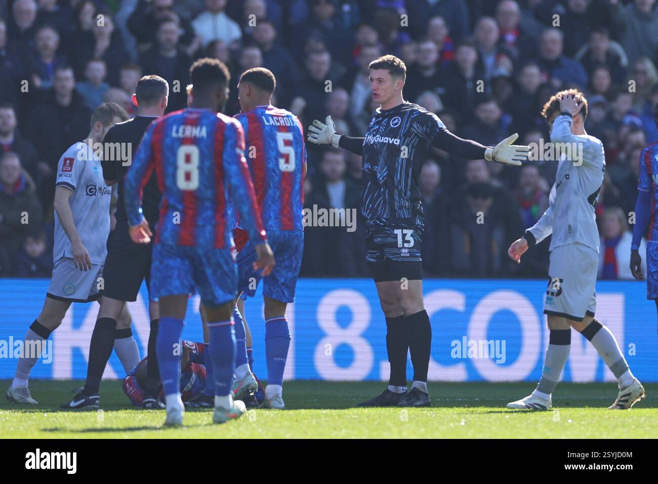 Millwall goalkeeper Liam Roberts reacts before getting a red card for a ...