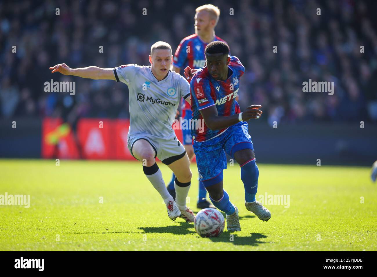 Millwall's Casper De Norre, left, challenges for the ball with Crystal ...