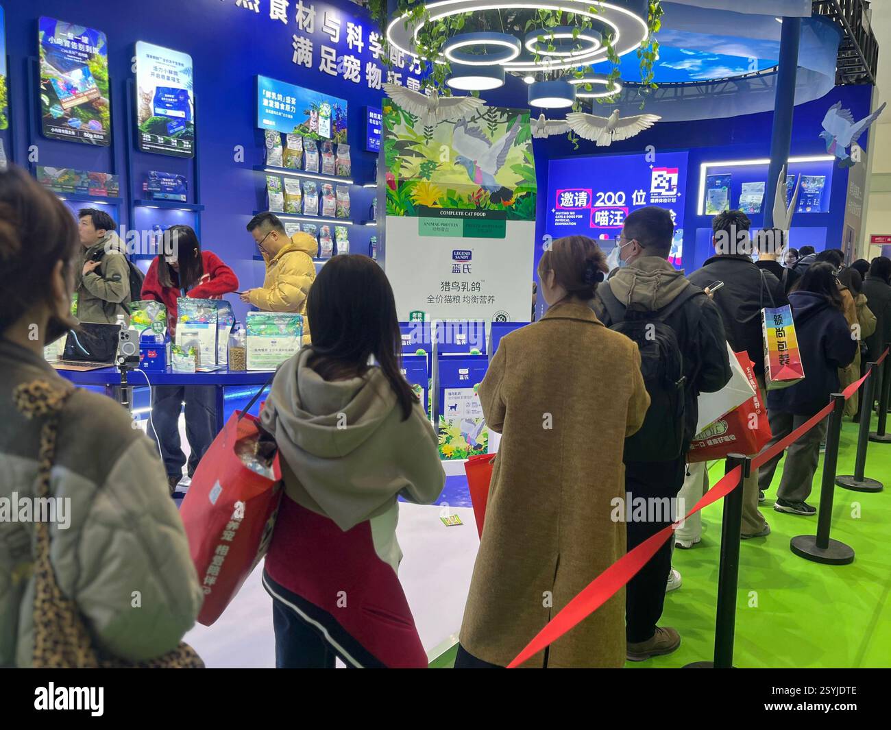Beijing, China. 27th Feb, 2025. Visitors queue up to claim gift packs ...