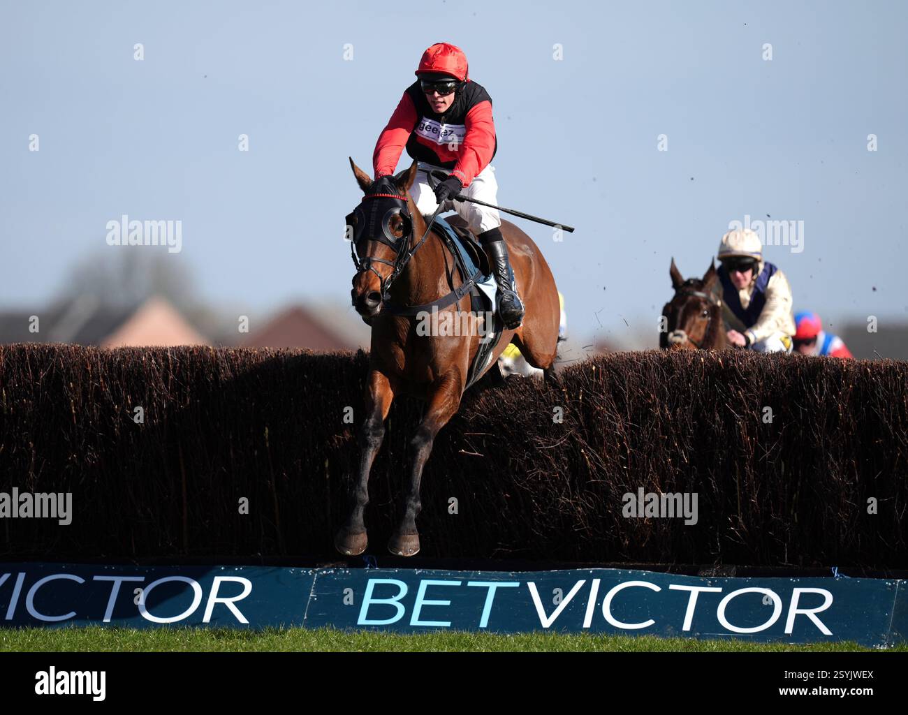 Sam Brown ridden by Chad Bament clears the last on their way to winning ...