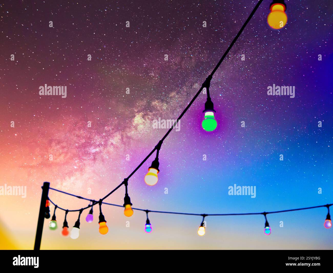 Coloured party bar lights at sunset against star spangled filled night ...