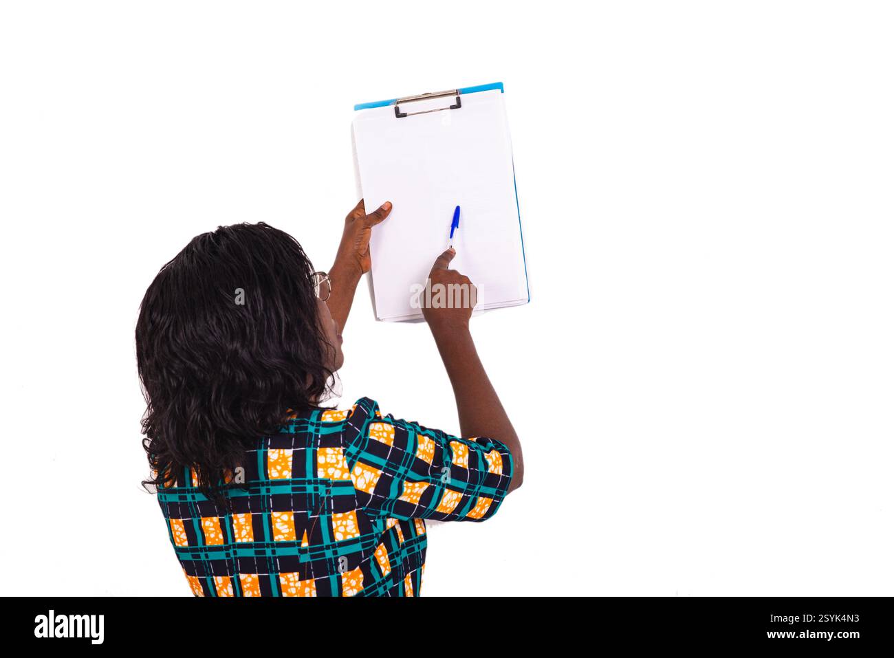 beautiful adult business woman pointing pen at clipboard Stock Photo ...