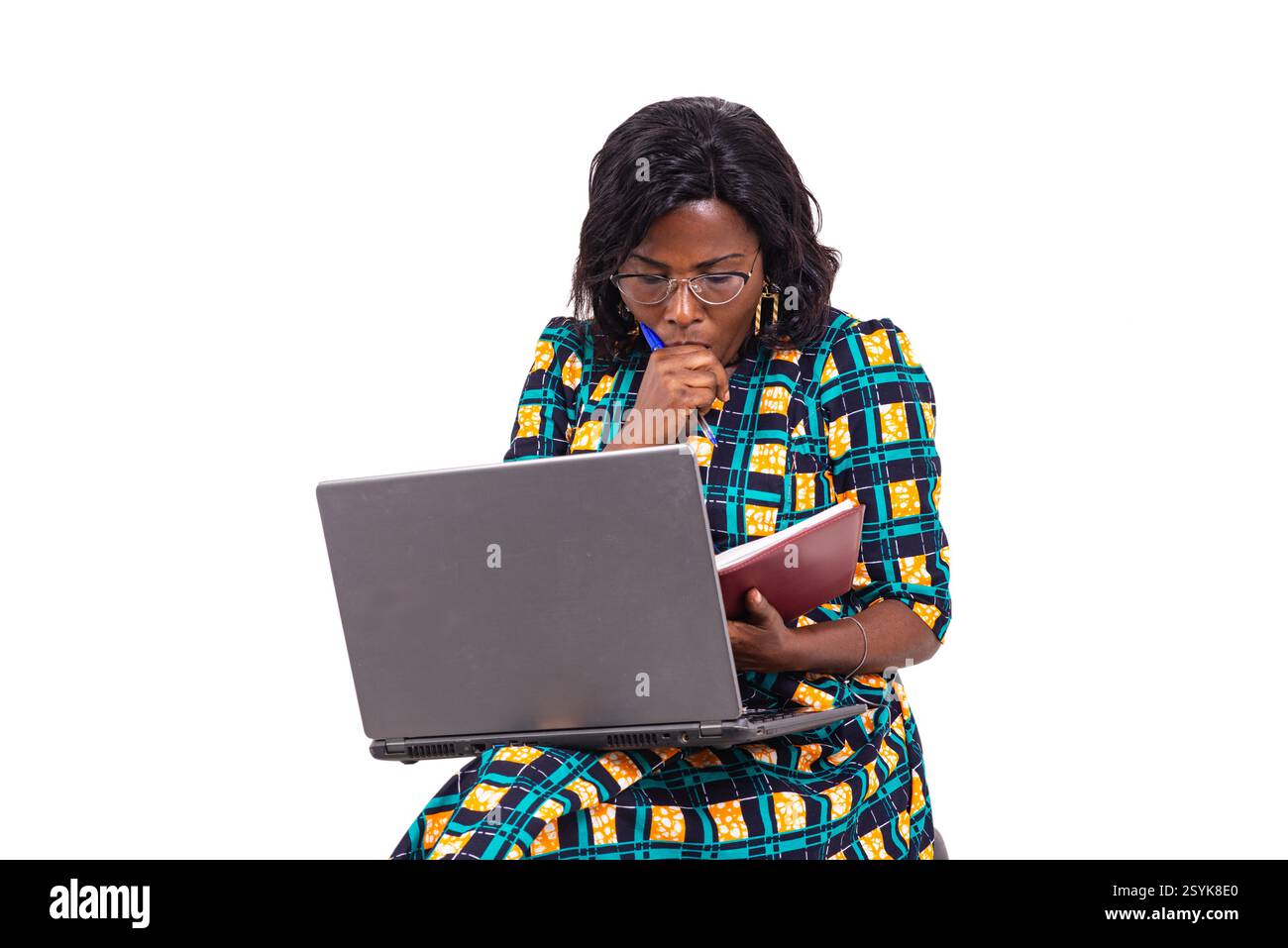 beautiful adult business woman sitting checking notes in notebook using ...