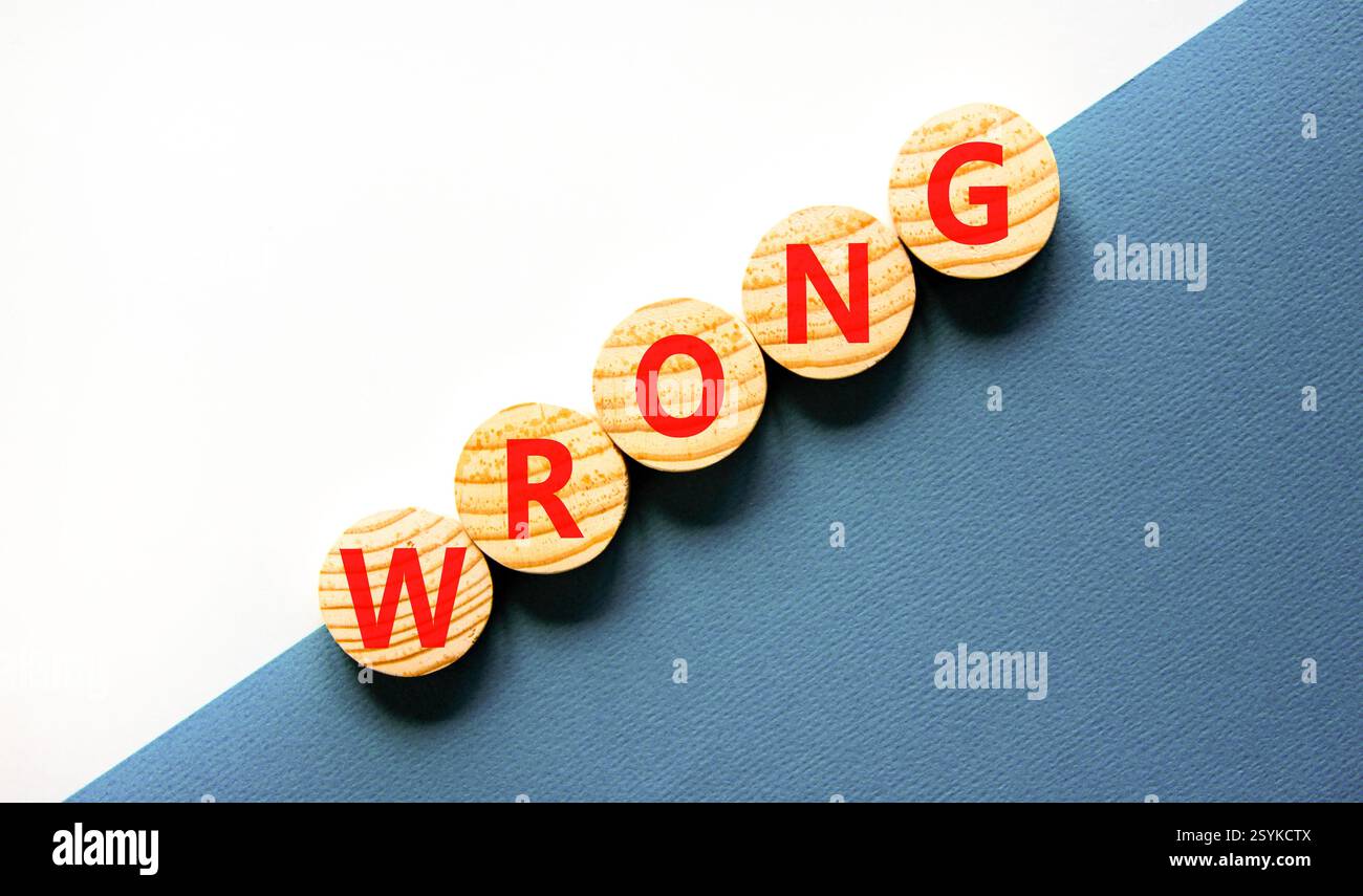 Wrong symbol. Concept word Wrong on beautiful wooden circles. Beautiful white and blue ...