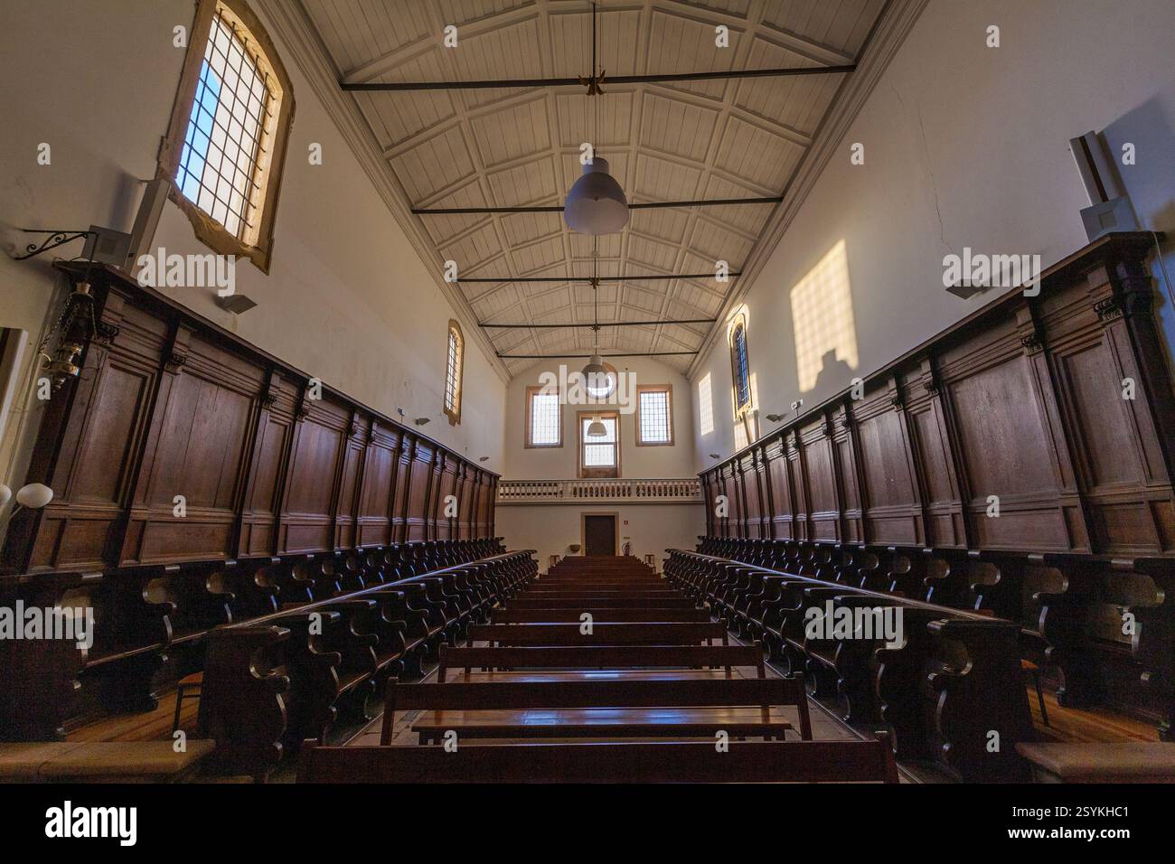 The interior of a historic church or monastery with a long, high ...