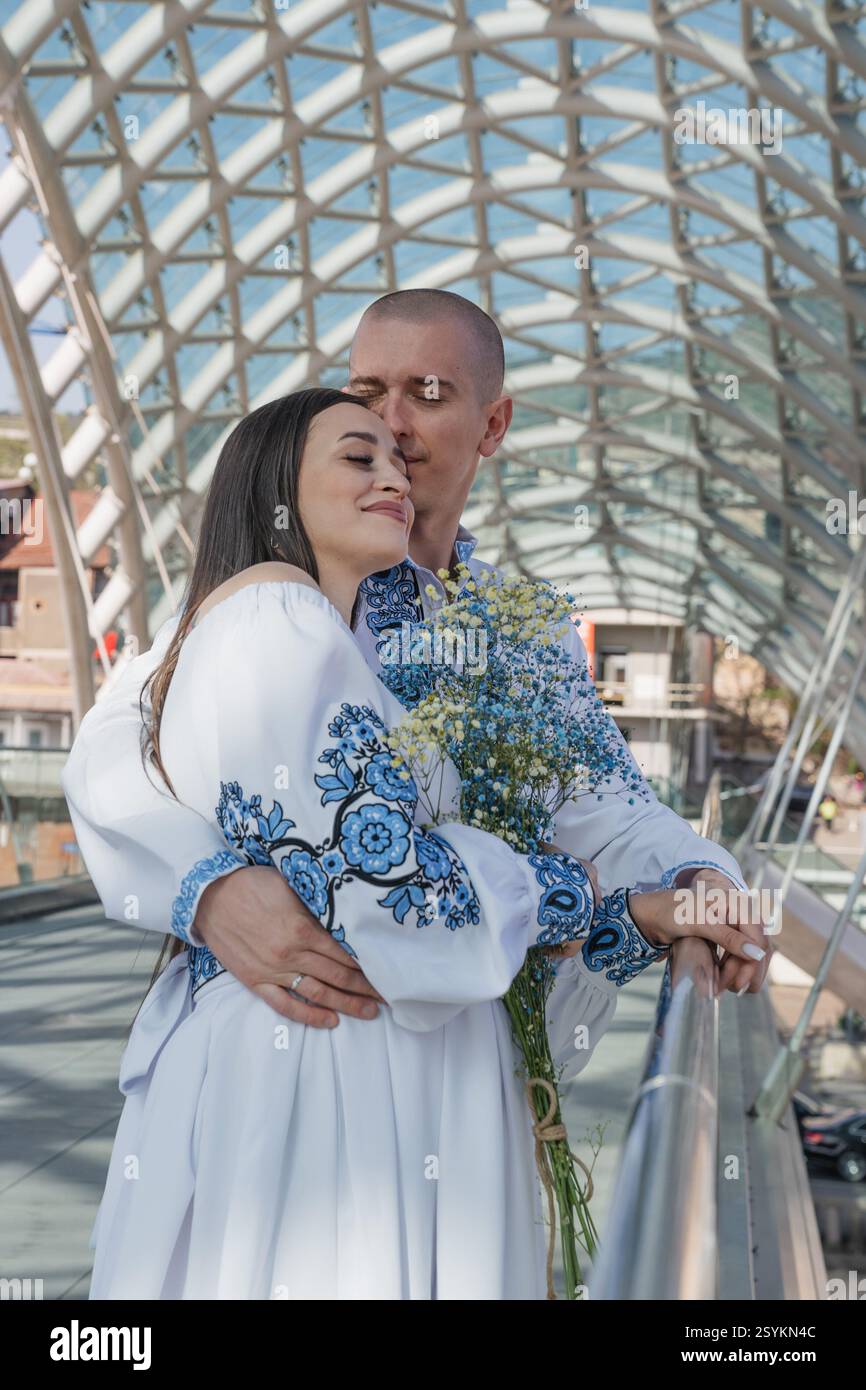 Elegant Ukrainian wedding couple near modern architecture Stock Photo ...