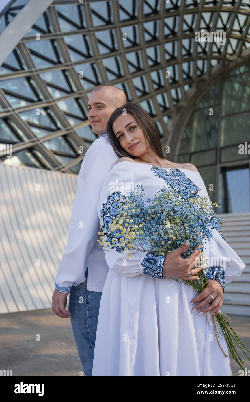 Elegant Ukrainian wedding couple near modern architecture Stock Photo ...