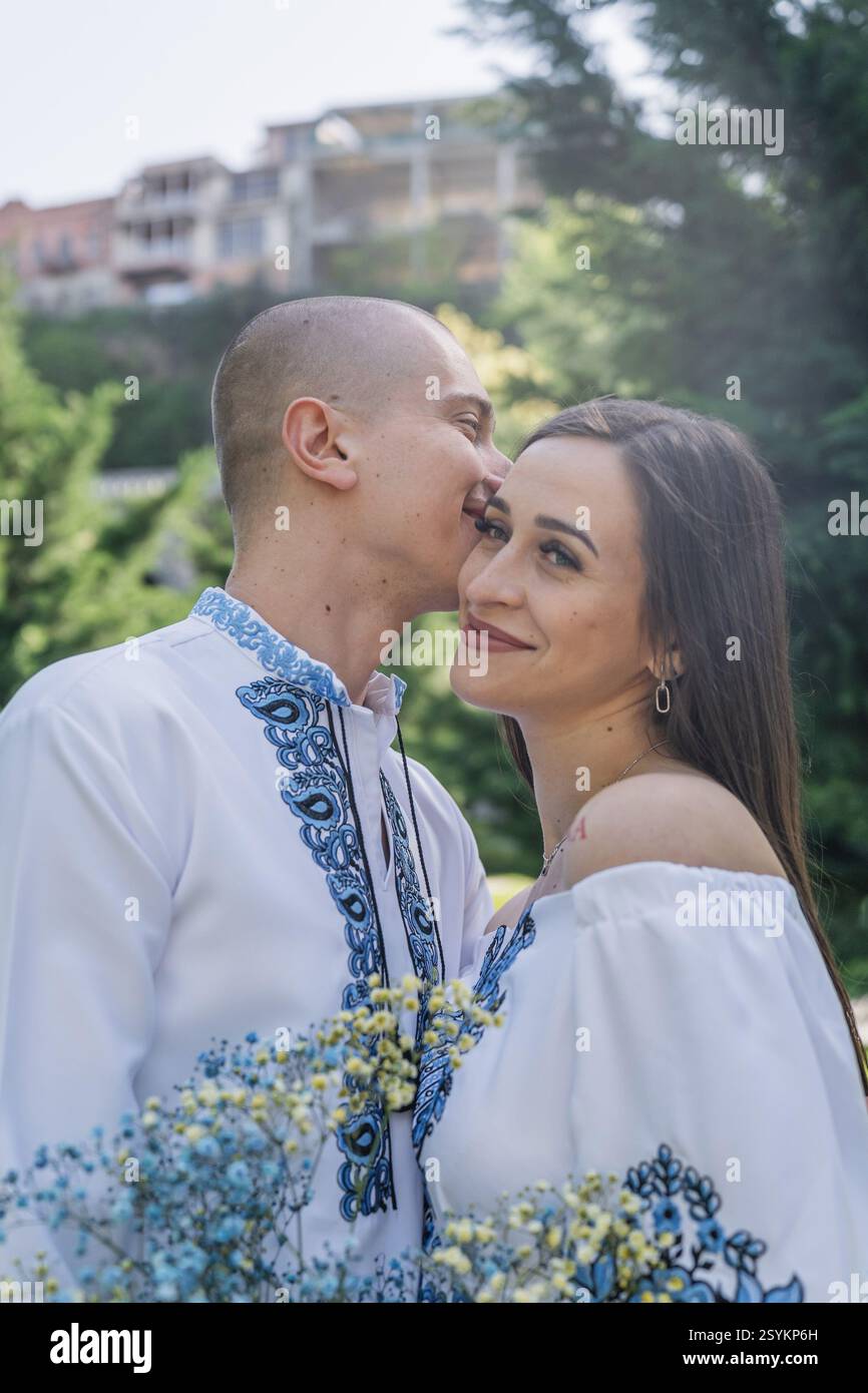 Elegant Ukrainian wedding couple near modern architecture Stock Photo ...
