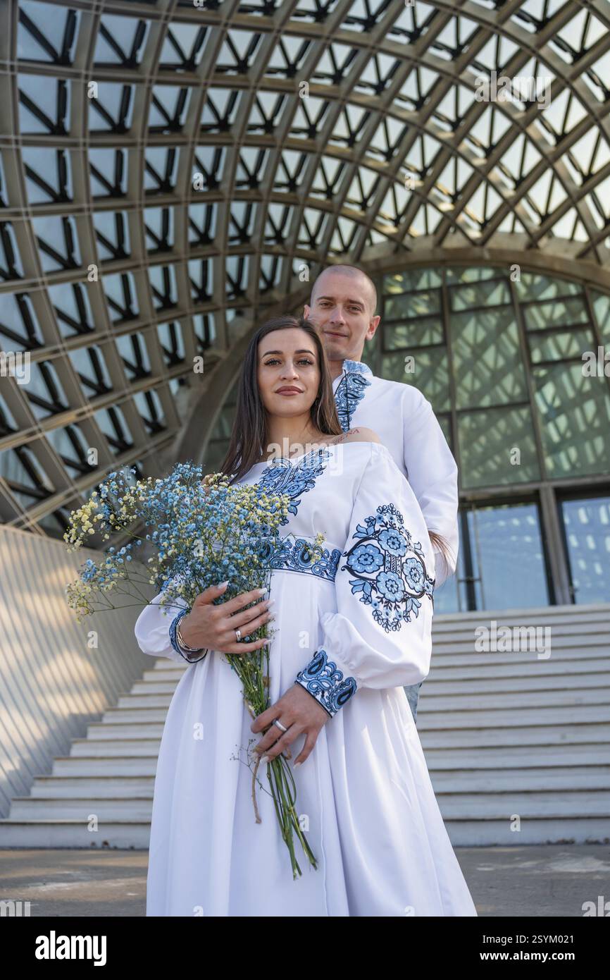 Elegant Ukrainian wedding couple near modern architecture Stock Photo ...