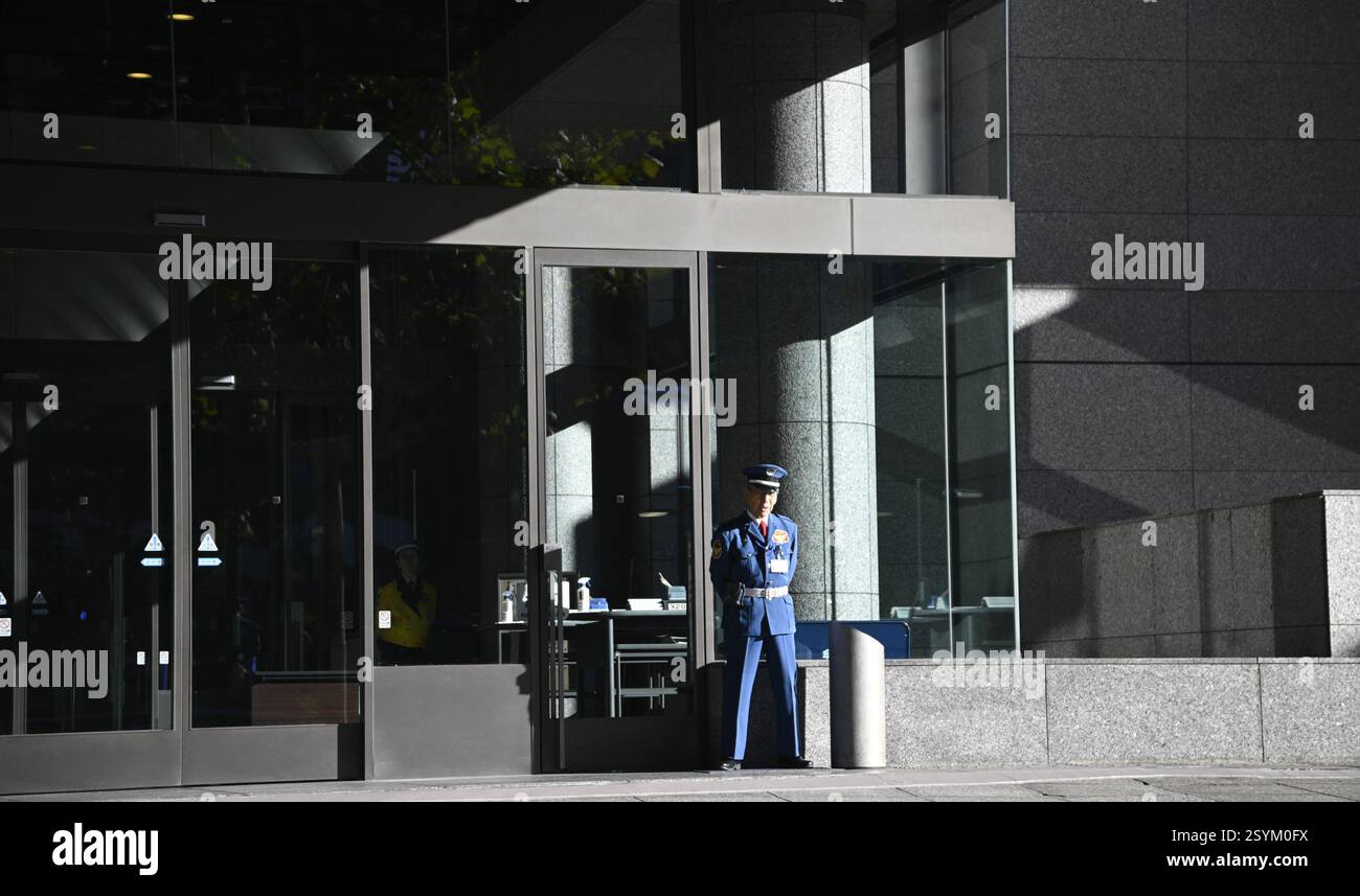 Security guard at the entrance of a luxury Department store on Chuo ...