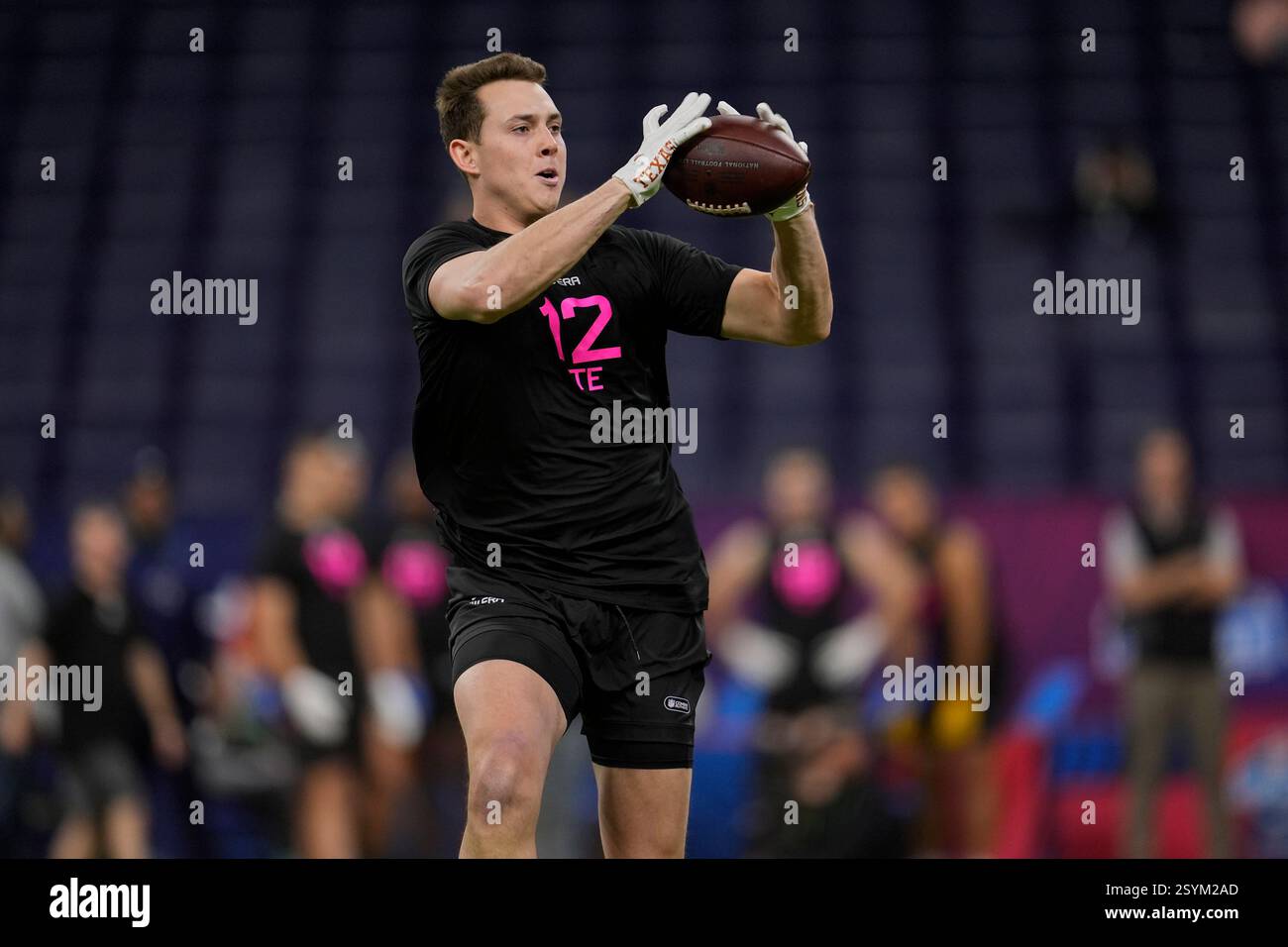 Texas tight end Gunnar Helm runs a drill at the NFL football scouting ...