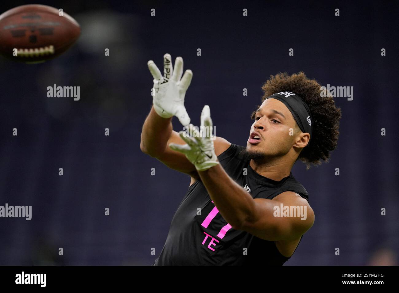 North Carolina tight end Bryson Nesbit runs a drill at the NFL football ...