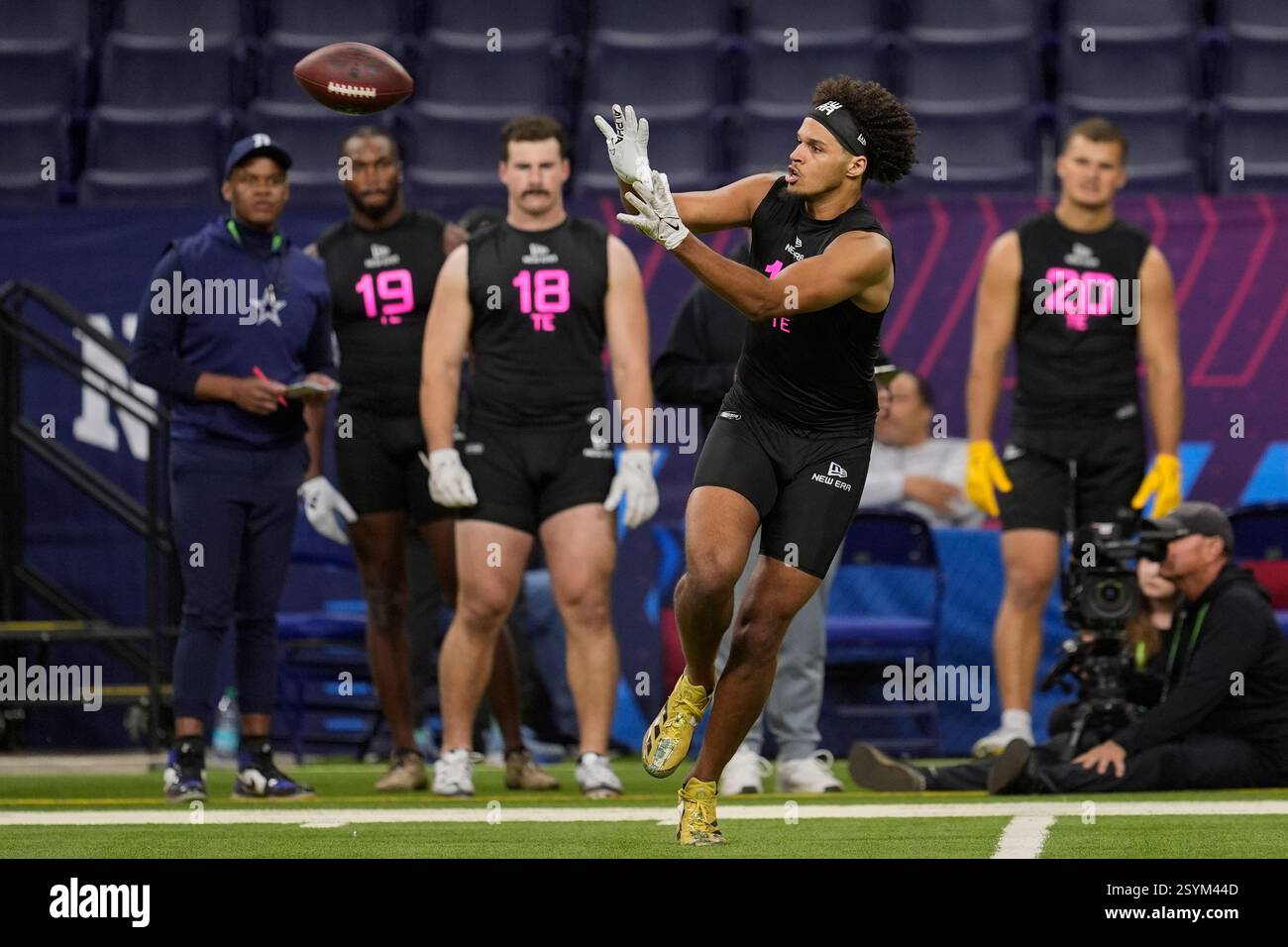 North Carolina tight end Bryson Nesbit runs a drill at the NFL football ...