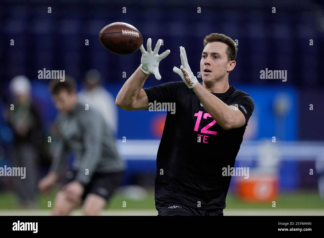 Texas tight end Gunnar Helm runs a drill at the NFL football scouting ...