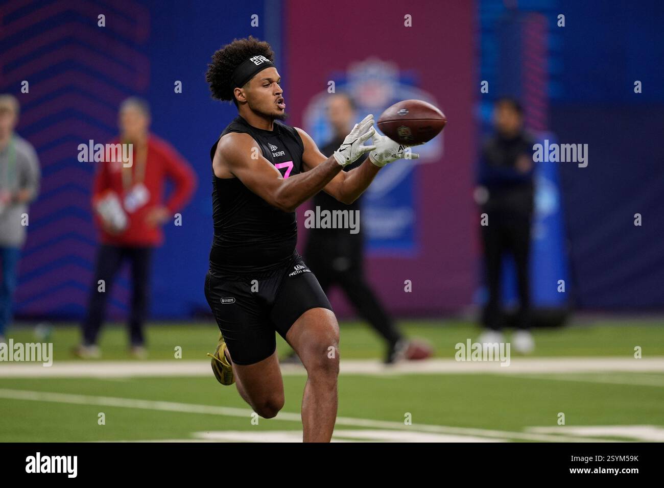 North Carolina tight end Bryson Nesbit runs a drill at the NFL football ...