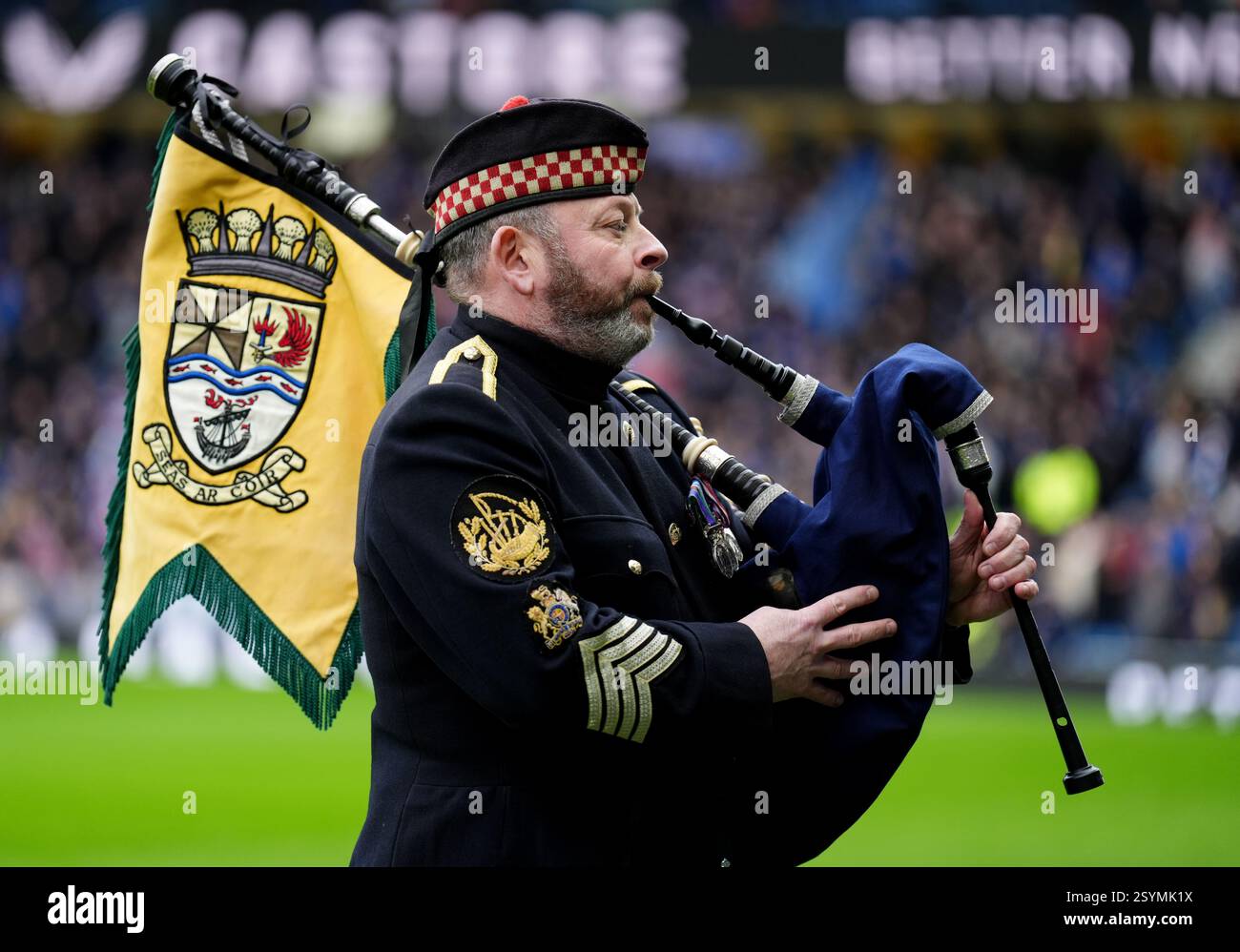 A piper plays for the crowd ahead of the William Hill Premiership match ...