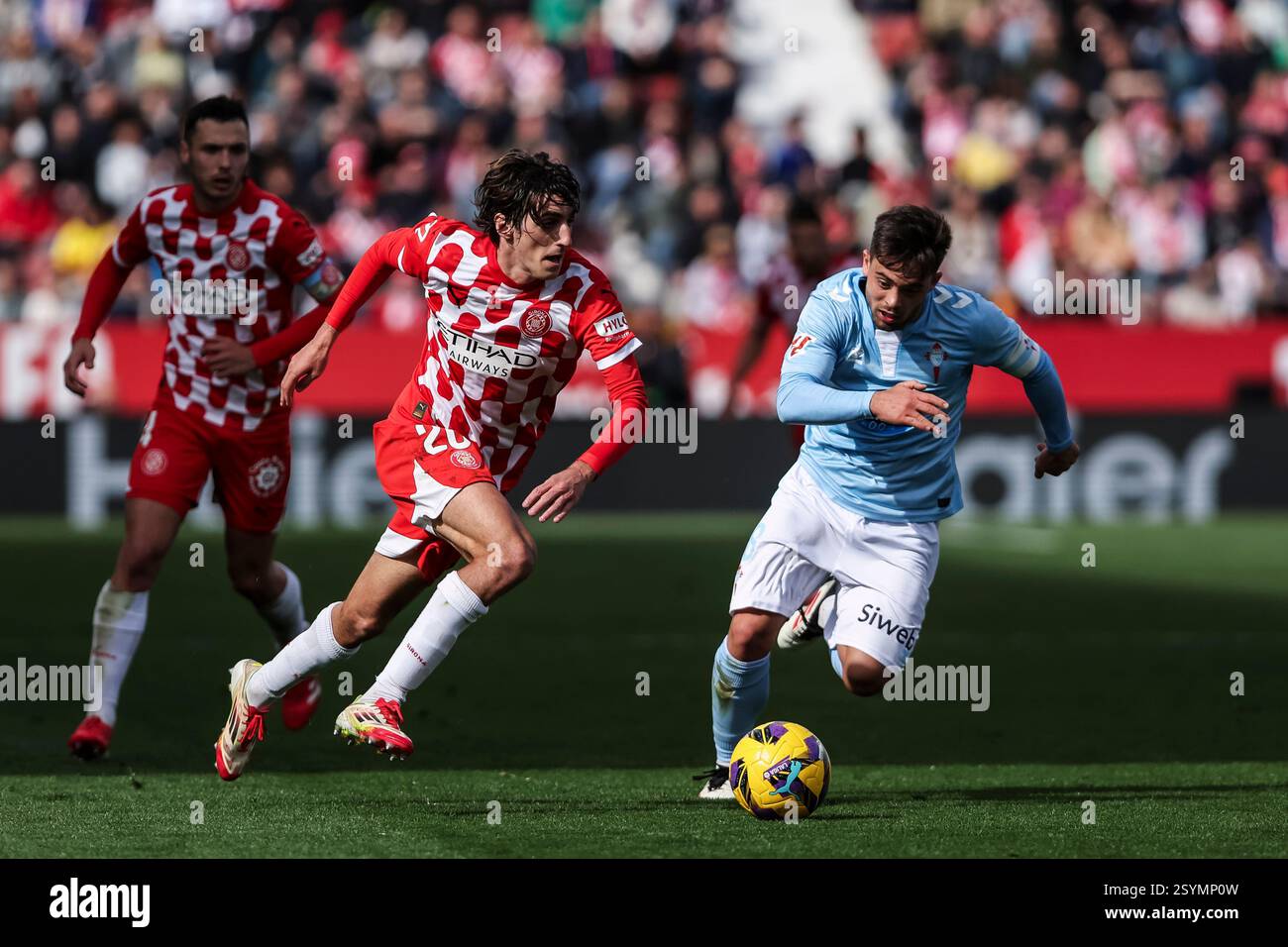 Bryan Gil of Girona FC and Fran Beltran of RC Celta in action during ...