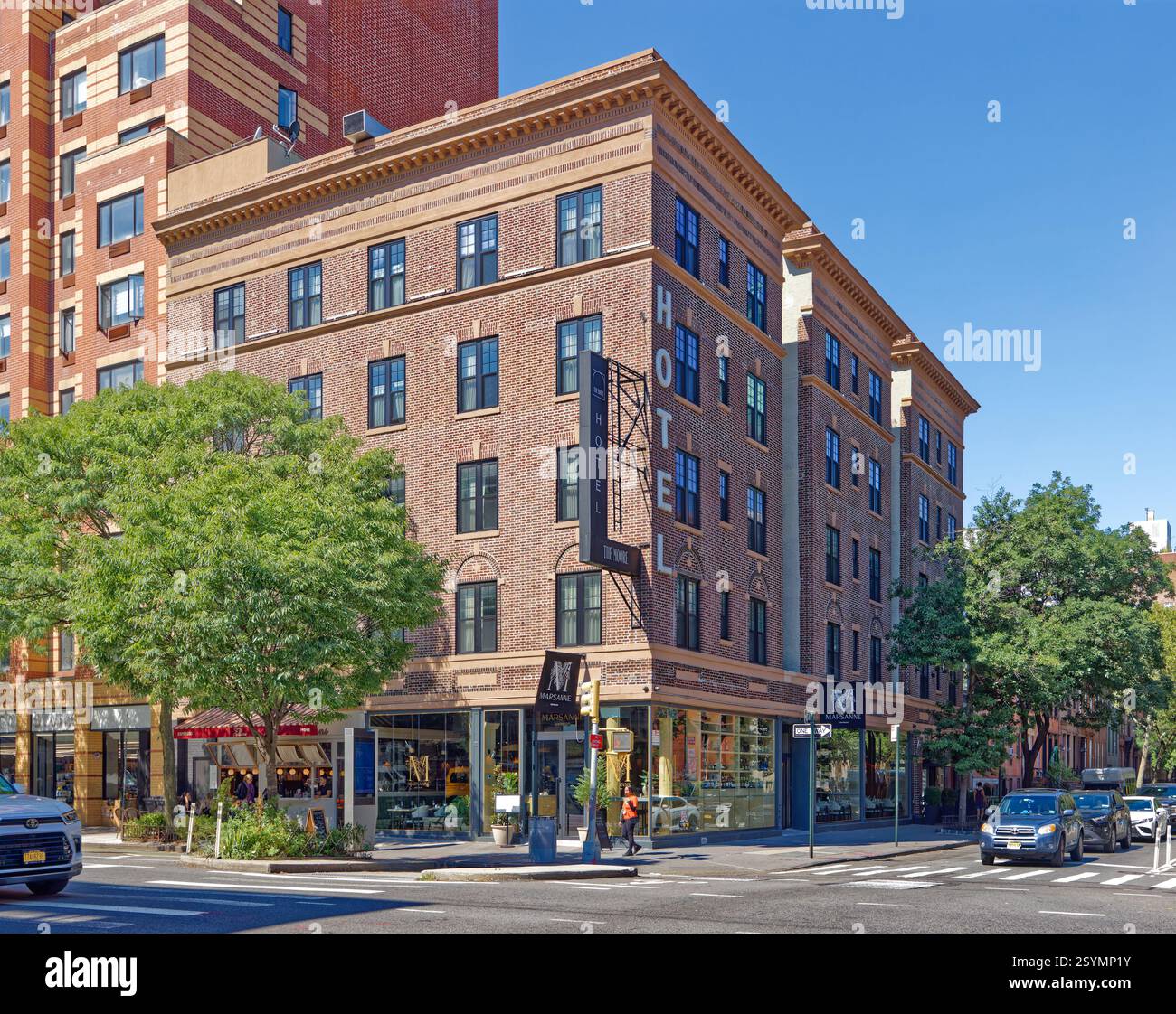 The Moore, a low-rise brick hotel at 300 West 22nd Street, with stores ...