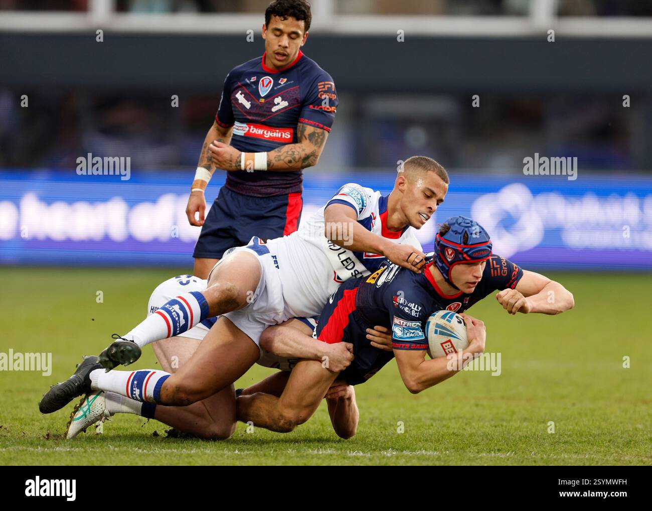 St Helens' Harry Robertson is tackled during the Betfred Super League ...