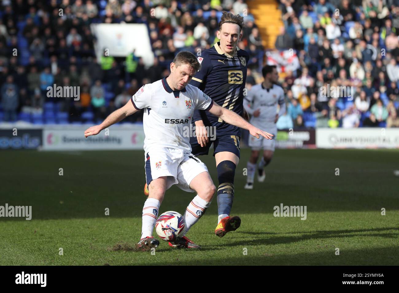 Sam Finley of Tranmere Rovers under pressure from Ronan Curtis of Port ...