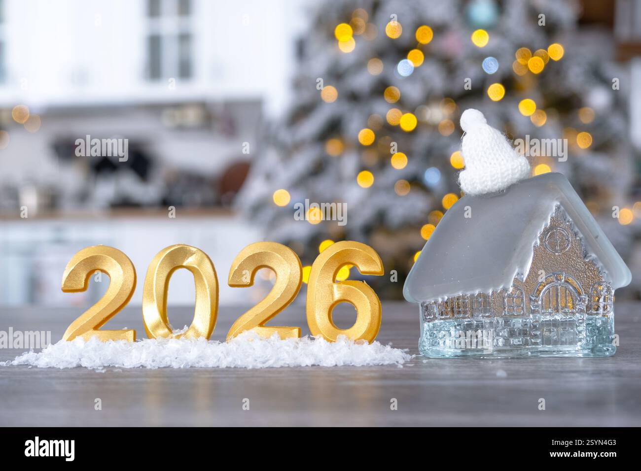 Golden number 2026 and tiny home on background of cozy white kitchen ...