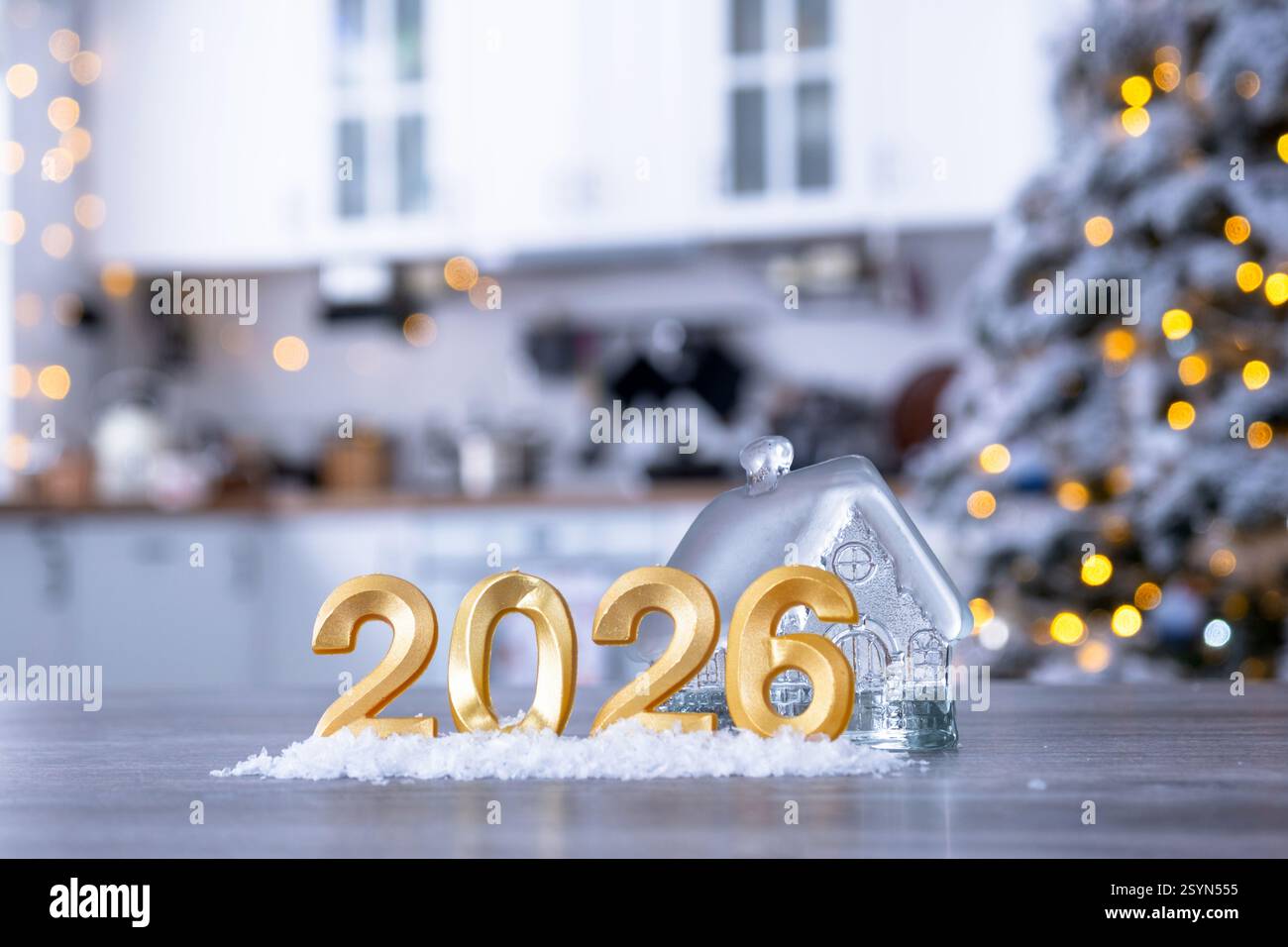 Golden number 2026 and tiny home on background of cozy white kitchen ...