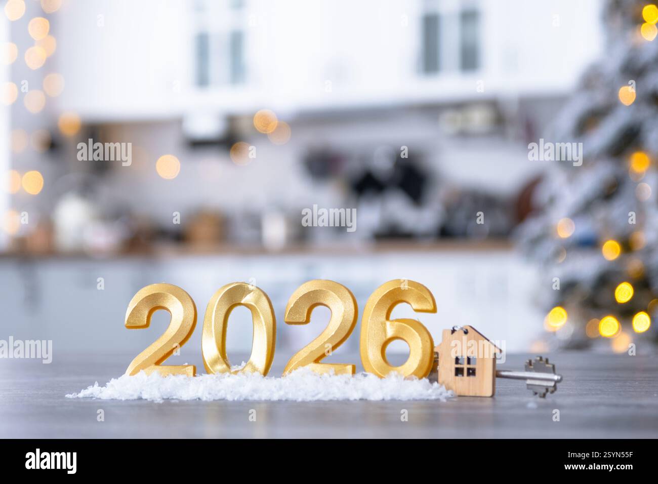 Golden number 2026, key and tiny home on background of cozy white ...