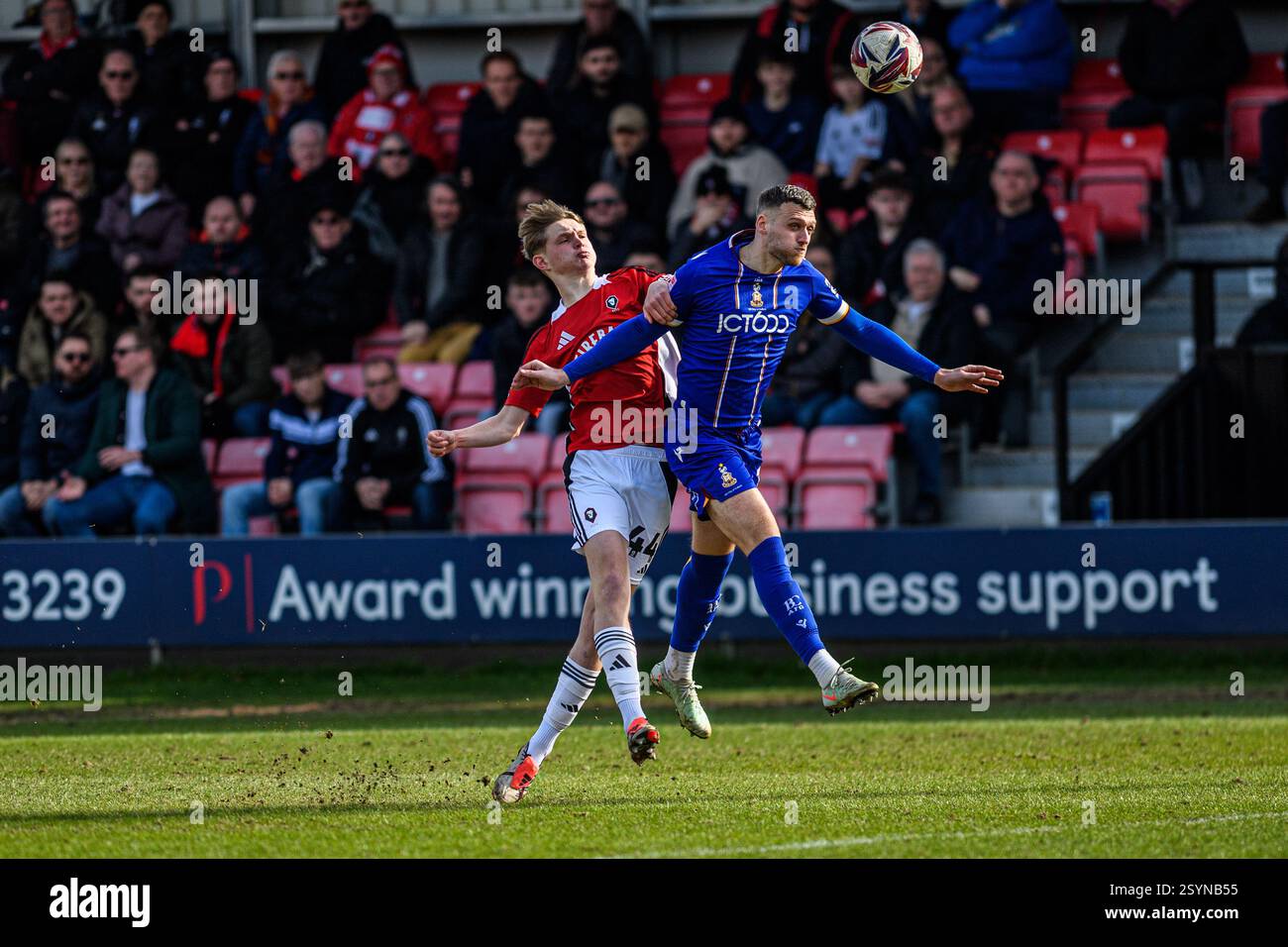 Will Wright of Salford City FC tackles Bradford City FC's Aden Baldwin ...