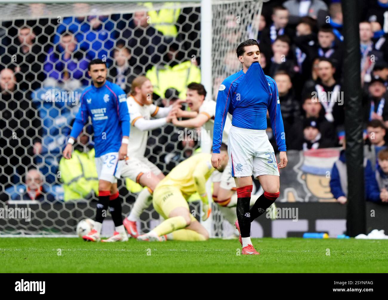 Rangers' Ianis Hagi (right) reacts as Motherwell's Tom Sparrow (rear ...