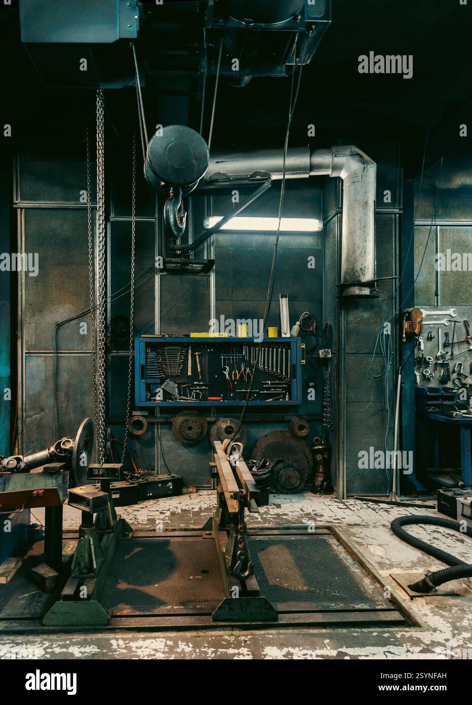 Close-up of an industrial workshop with a tool board, wrenches, pliers ...