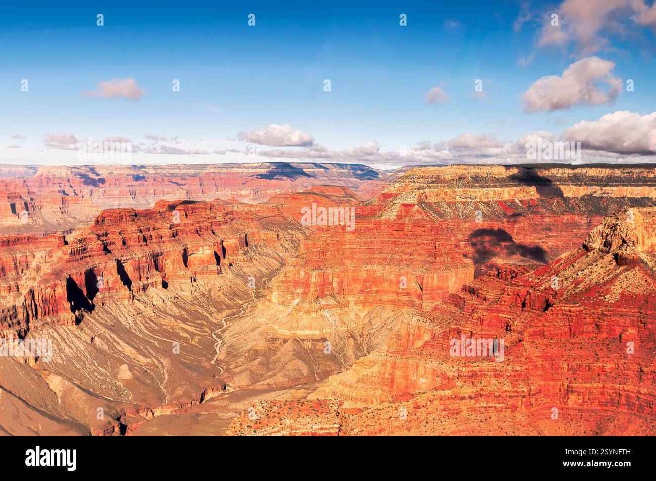 A breathtaking view of the Grand Canyon, showcasing its vastness and the intricate layers of ...