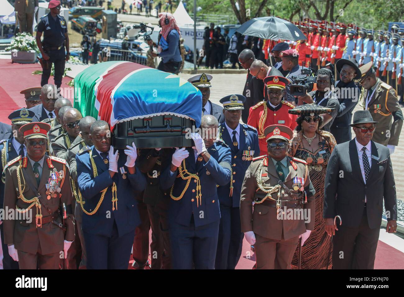 Pall-bearers carry the casket containing the remains of Namibia's ...