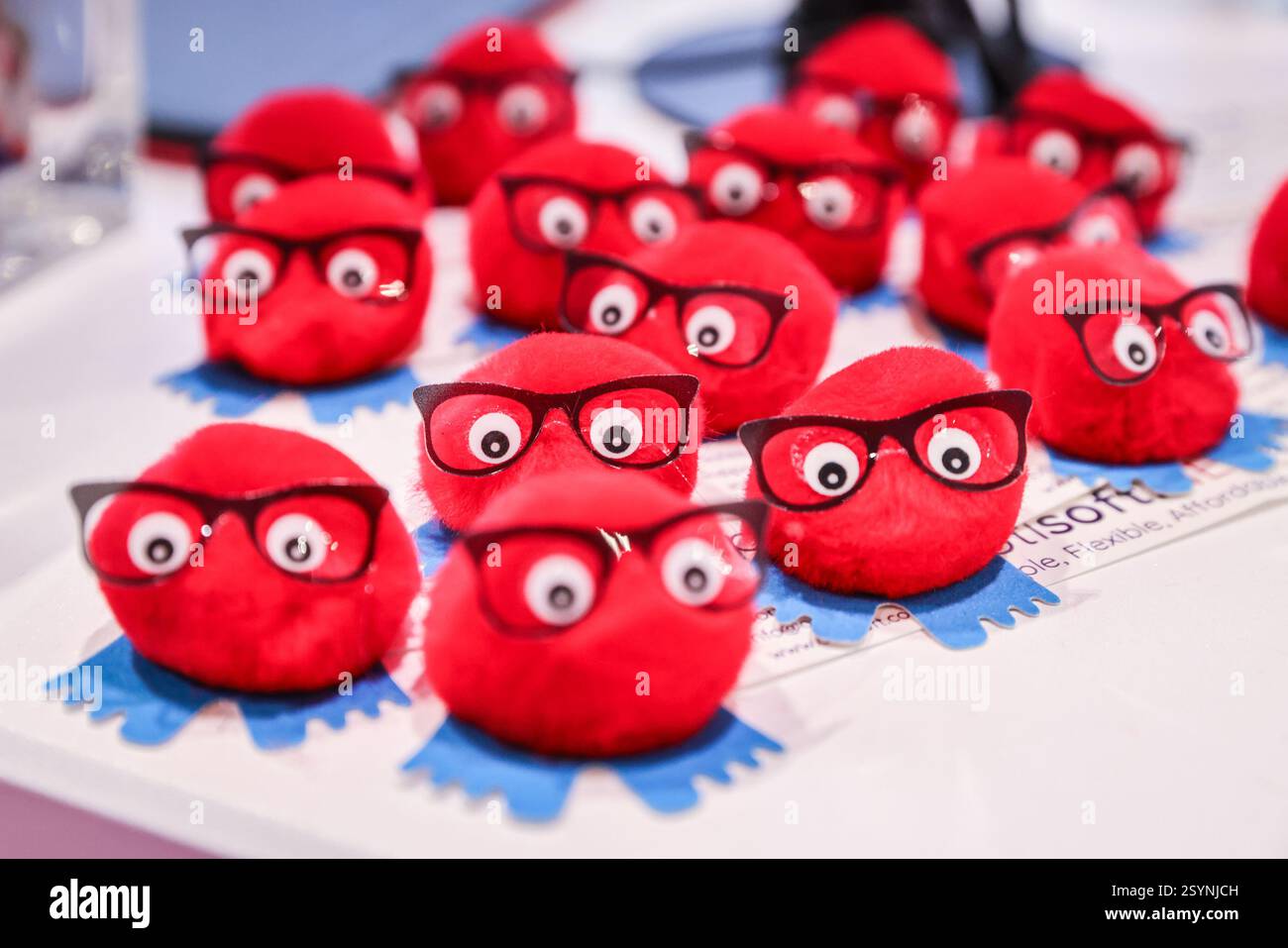 London, UK. 01st Mar, 2025. Giveaways at a booth. 100% Optical is the ...