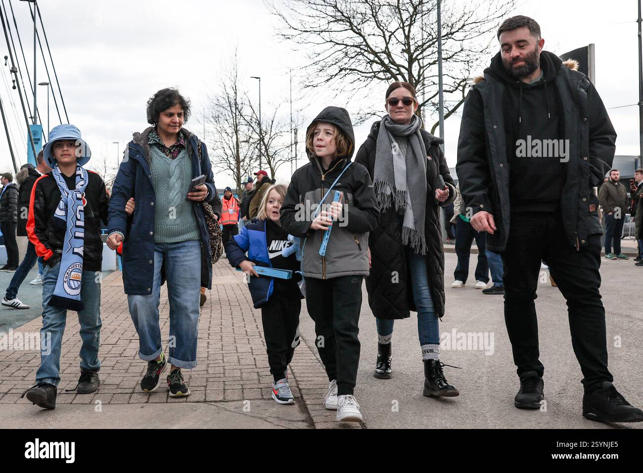 Fans arrive at the Etihad Stadium during the Emirates FA Cup 5th Round ...
